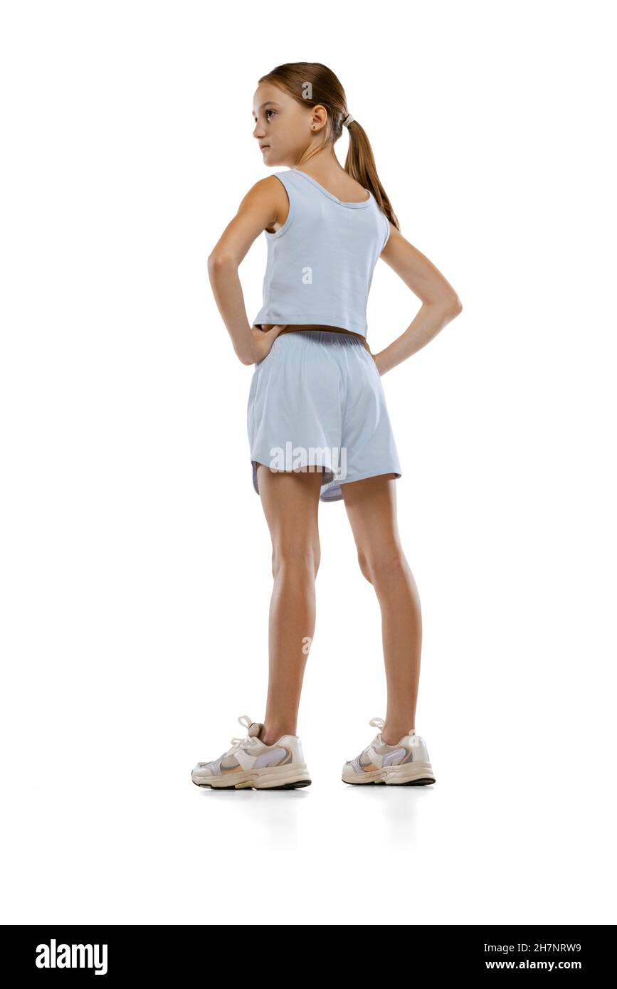 Full-length side view portrait of teen girl, professional sportsman ...