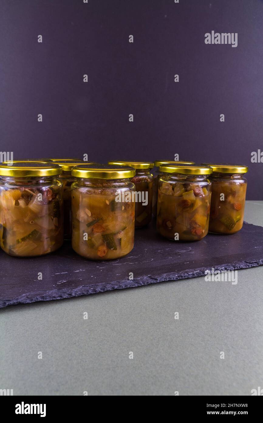 Chutney after courgette grew into marrow. Several jars black dark ...