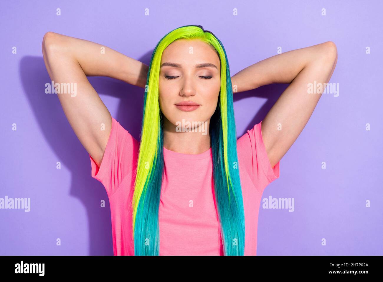 Photo of tranquil lady with colorful multicolored hairstyle sleep arms head isolated over violet ...