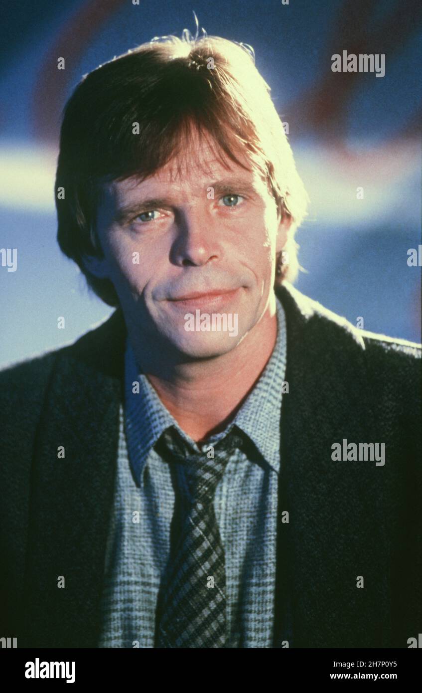 French singer Pierre Bachelet on a TV show ca.1985 Stock Photo - Alamy