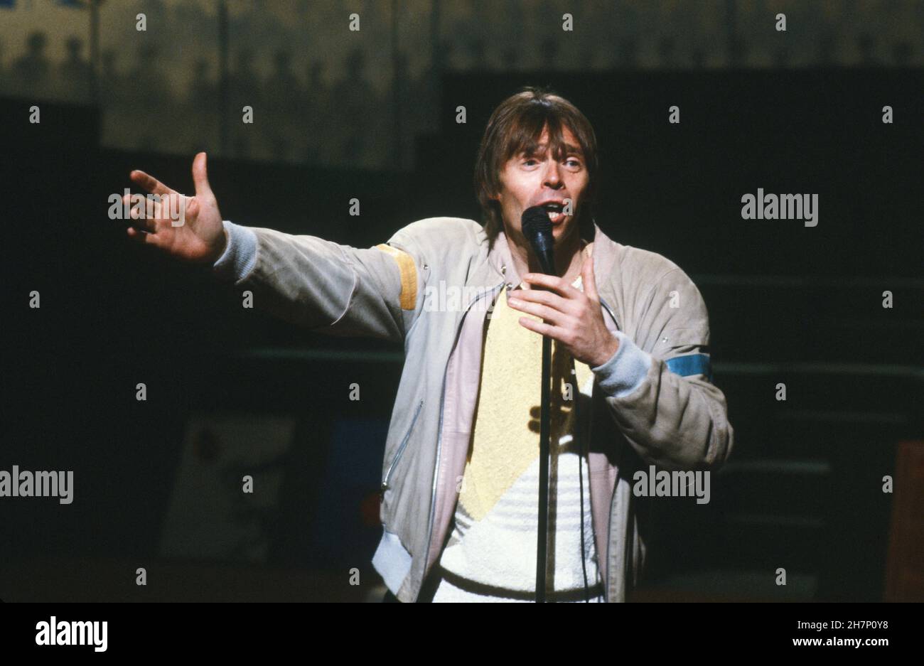 French singer Pierre Bachelet on a TV show ca.1985 Stock Photo - Alamy