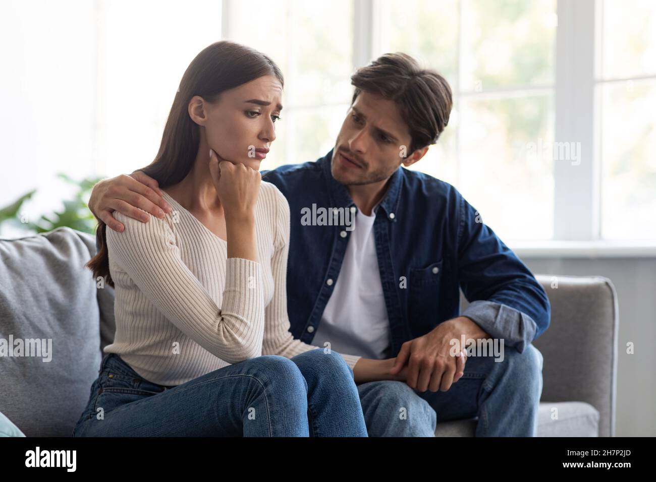 Careful European Millennial Man Calms Unhappy Sad Offended Woman After