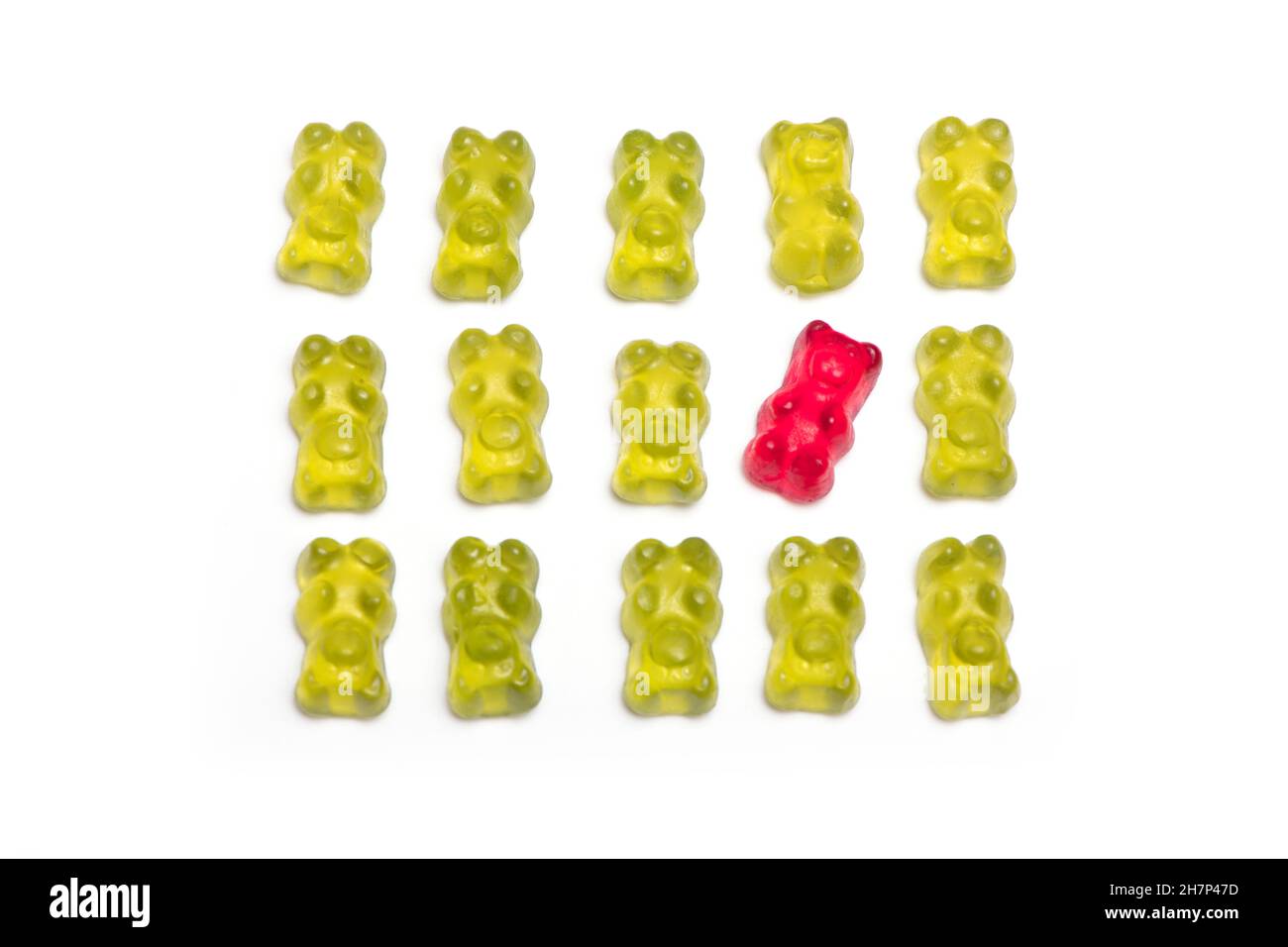 Rows of green gummy bears in which one red guy behaves differently from ...