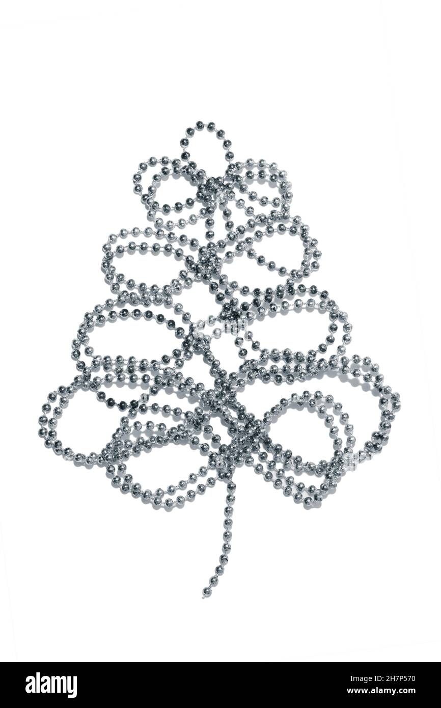 Artificial Christmas tree isolated on white, made of festive chain ...