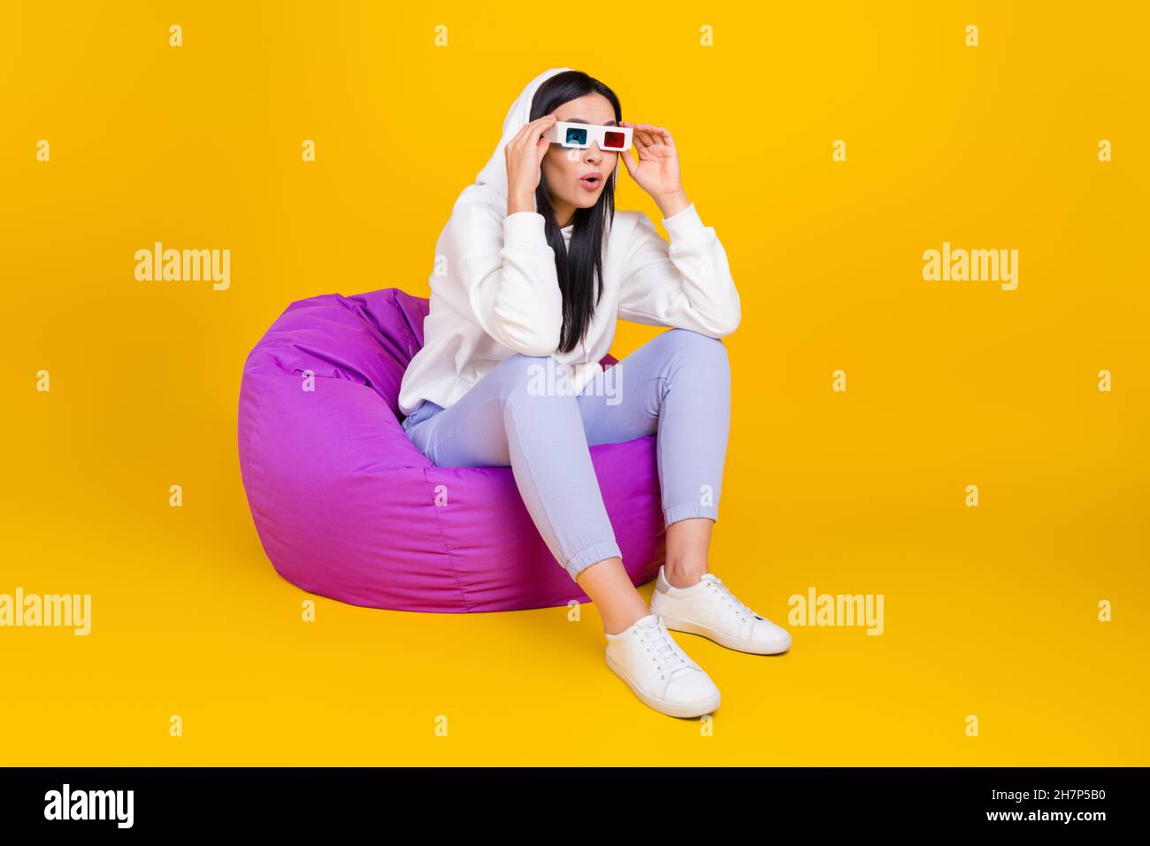 Full length photo of impressed youth lady sit bad chair watch horror ...