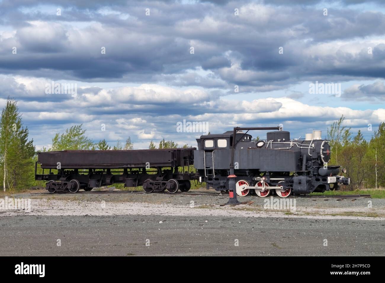Old steam locomotive on the siding. Old Soviet engine on the siding ...