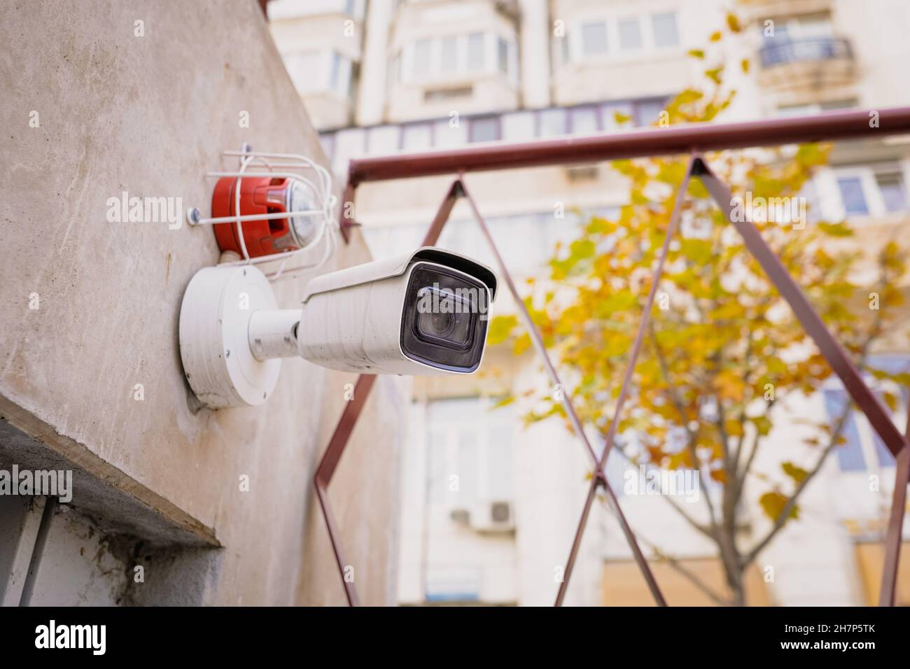 Details with a CCTV camera on a wall outside a building Stock Photo - Alamy