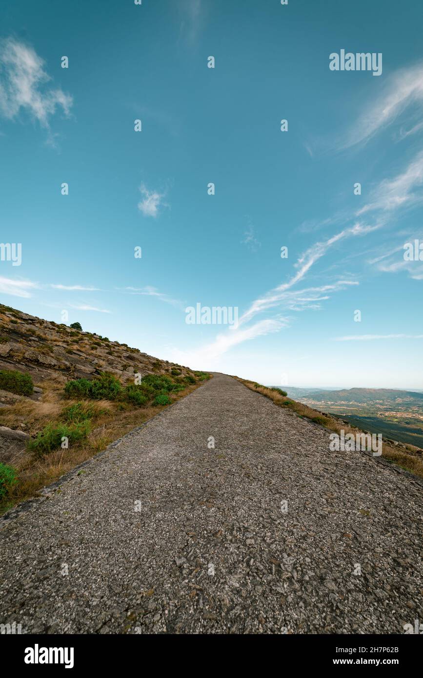 Narrow asphalt road on the hills Stock Photo - Alamy