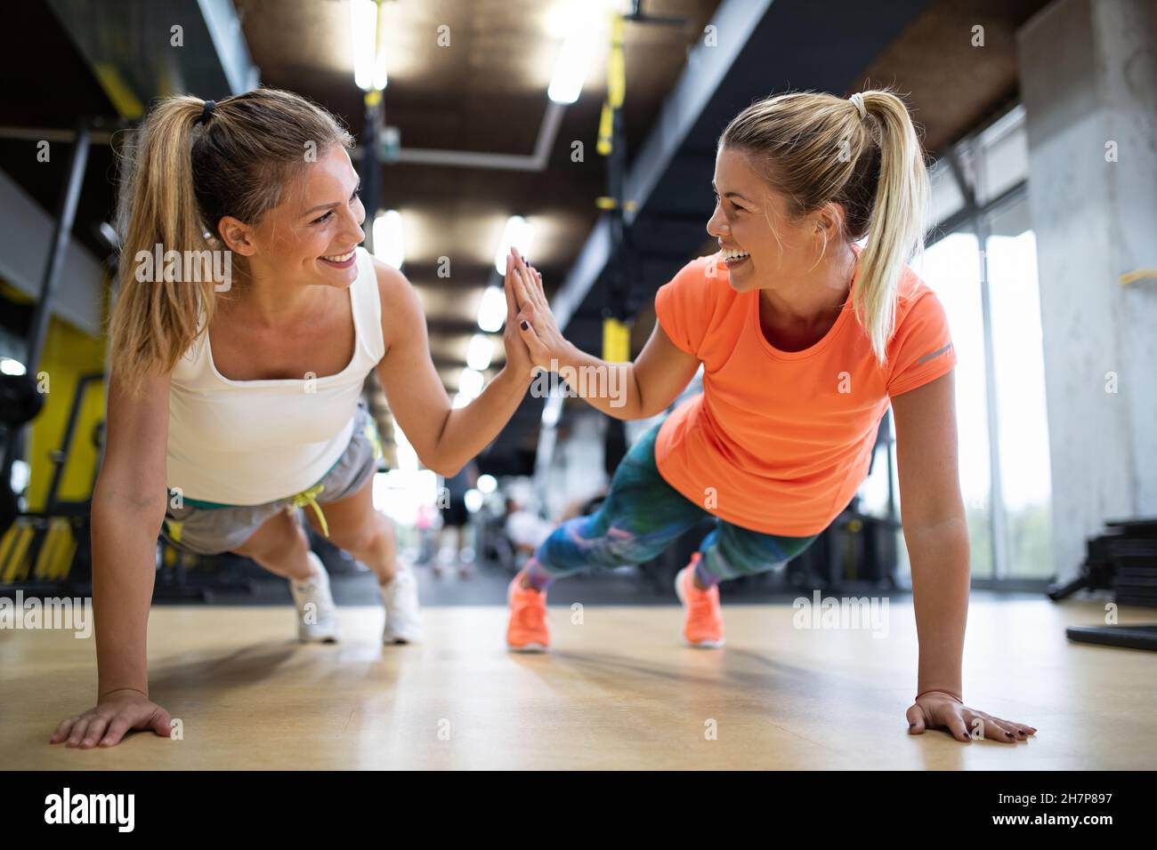 Portrait of happy fit group of people working out in gym together Stock ...
