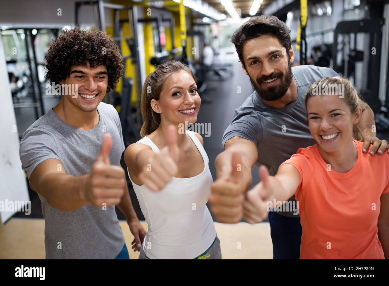 Portrait of happy fit group of people working out in gym together Stock ...