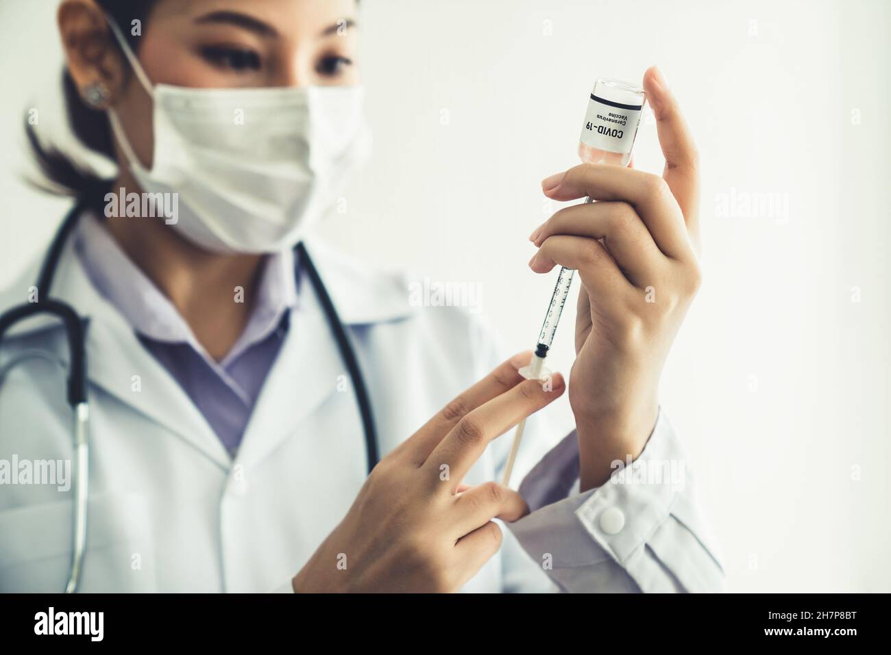 Skillful doctor prepare vaccine proficiently before injection . Covid ...