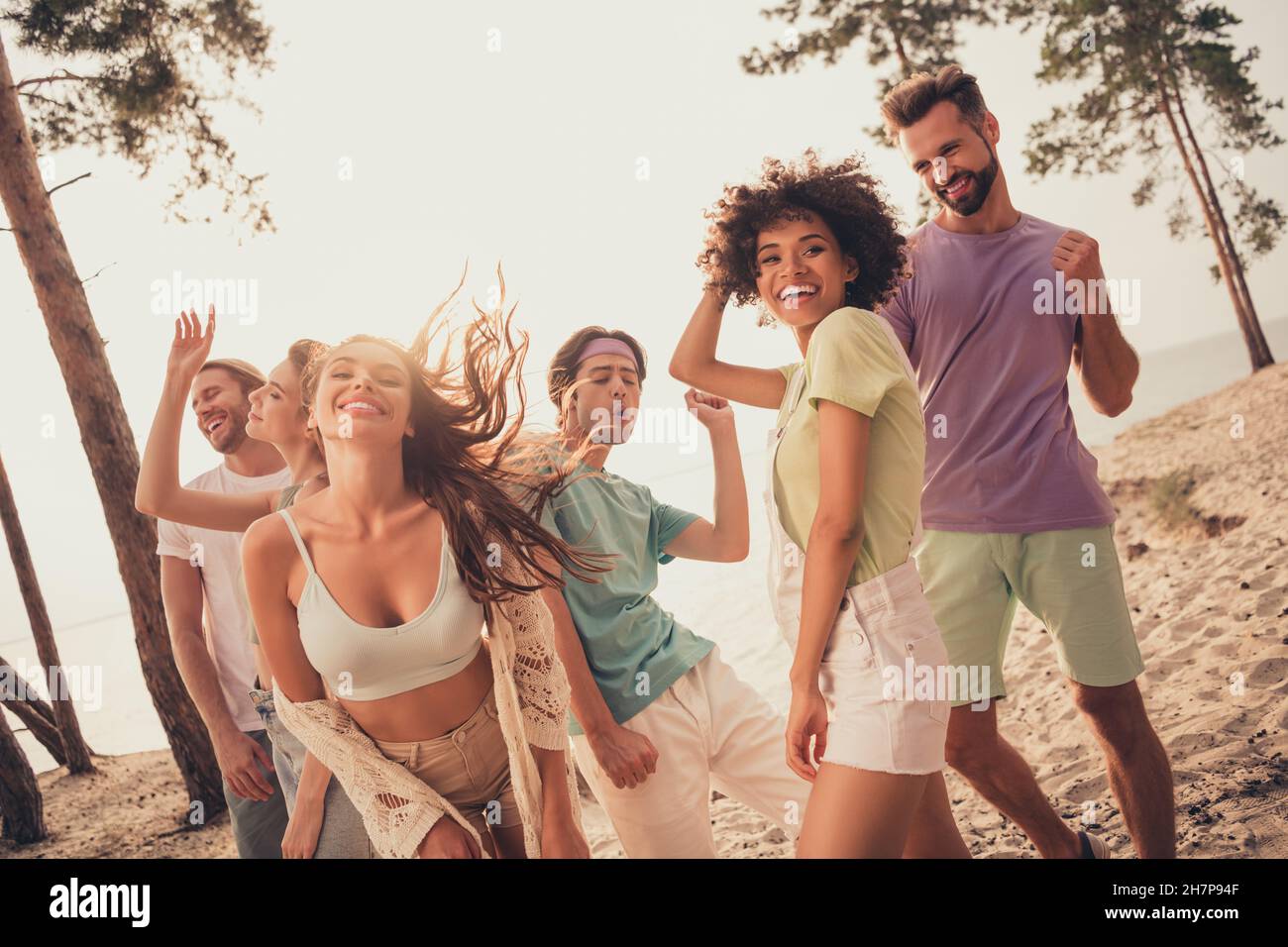 Portrait of attractive cheerful people group spending day dancing chill ...