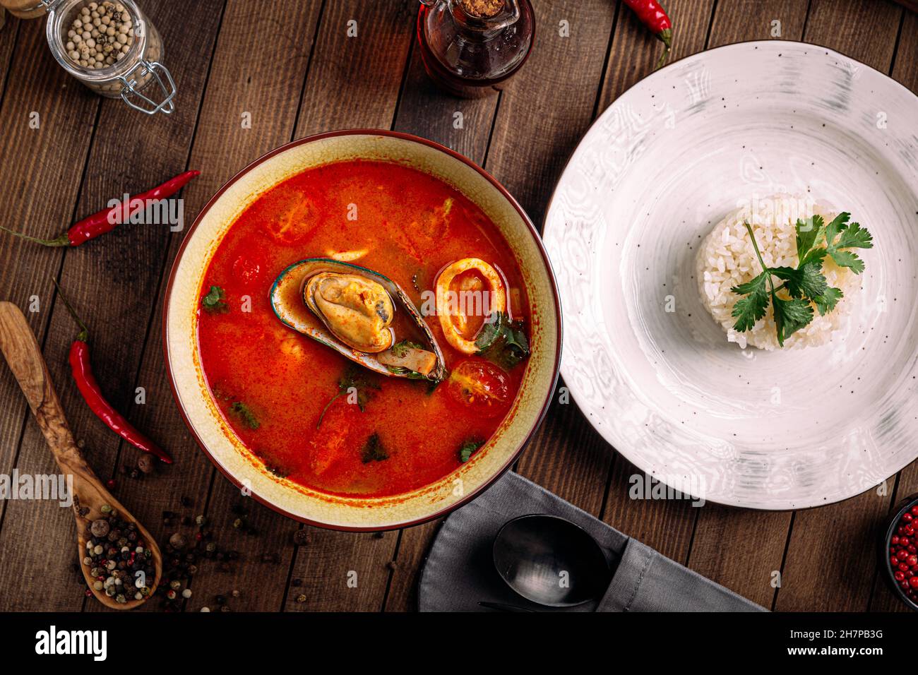 Gourmet thai seafood soup tom yam with rice Stock Photo - Alamy