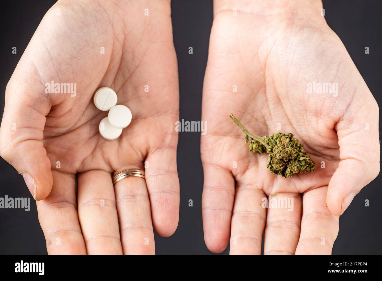 Marijuana and pills on female palms. Medical cannabis as an alternative ...