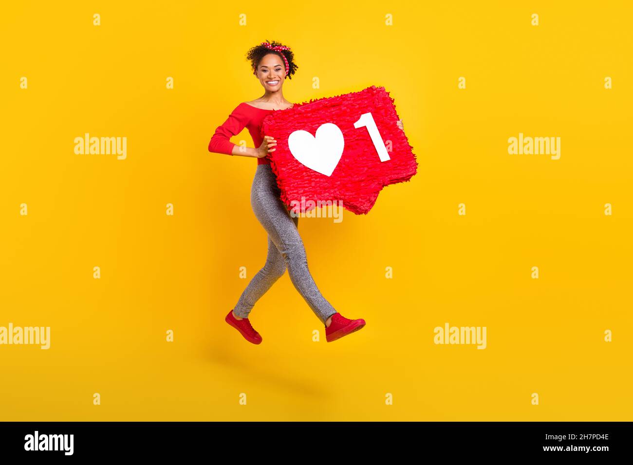 Photo of nice celebrity influencer lady jump hold one like pinata wear ...