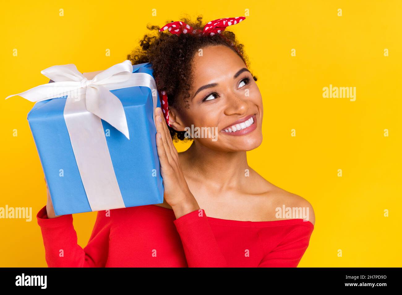 Photo of curious lady hold gift box try guess present empty space wear ...