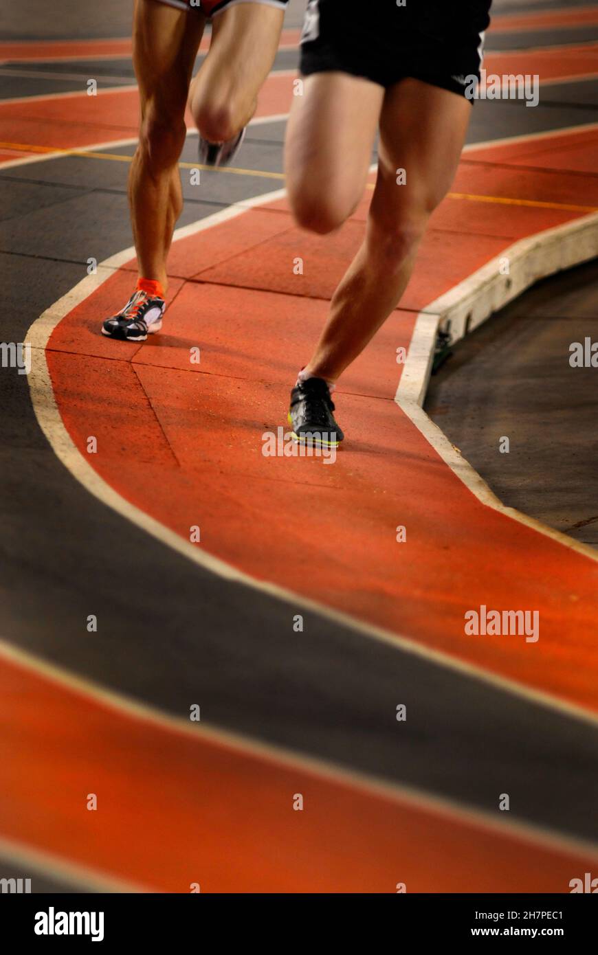 Running a race on a track for sports competition and winning indoor run ...