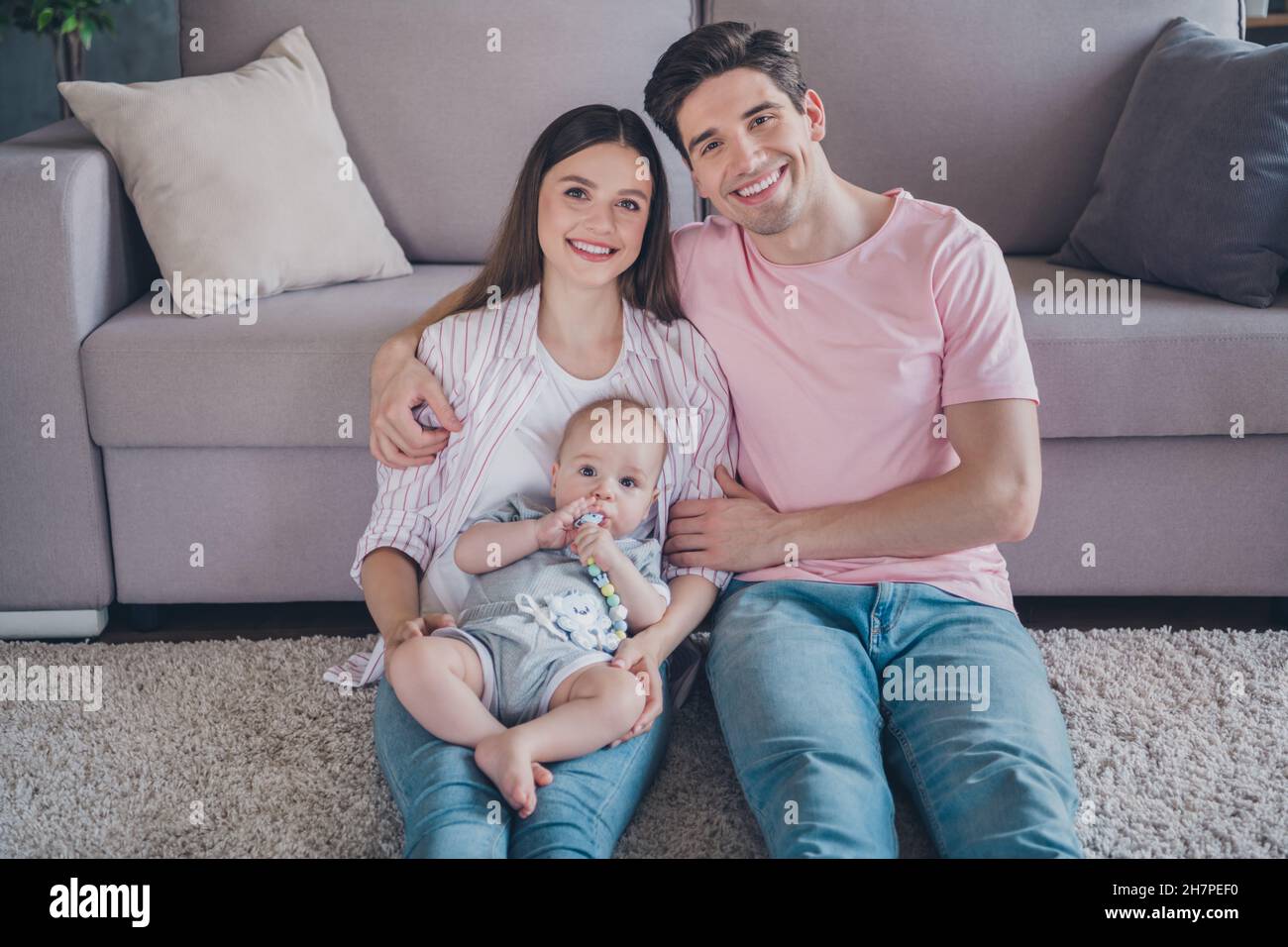 Couple holding cuddling little baby hi-res stock photography and images ...