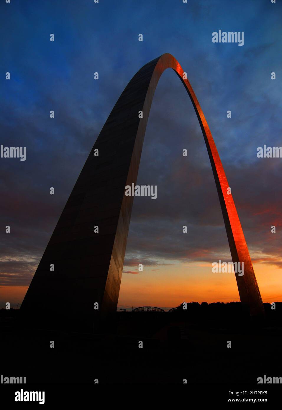 St Louis Arch landmark metal gateway sunset glowing orange with a blue ...