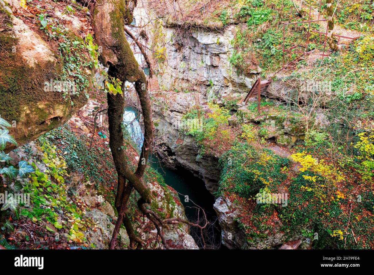 a deep stone gorge with a river at its bottom Stock Photo - Alamy