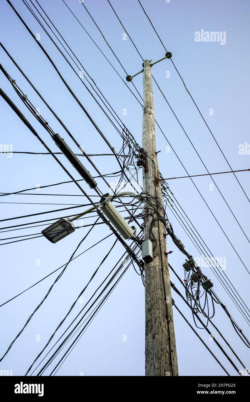 Cables, fiber optic cable and power lines on the pole. Pole with power ...