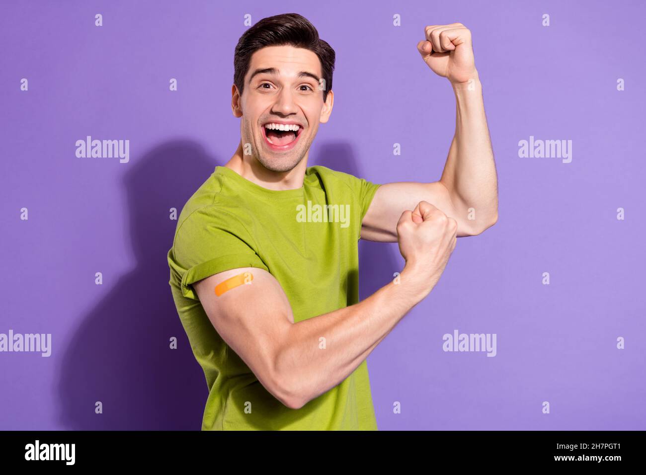 Portrait of attractive cheerful guy rejoicing after vaccine injection ...