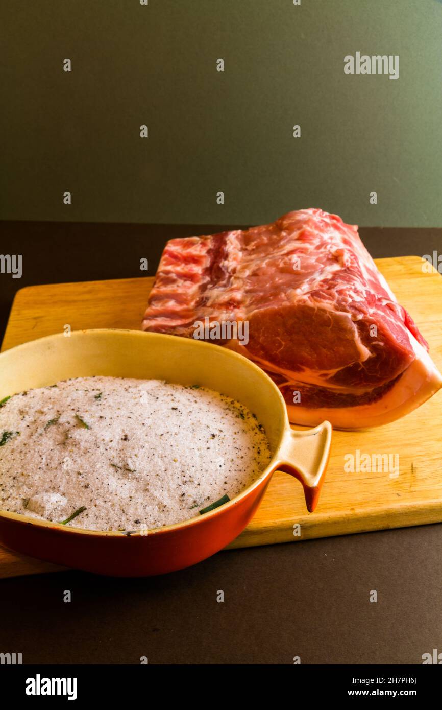 View of dish with dry cure for bacon, salt, sugar, bay leaf, pepper ...
