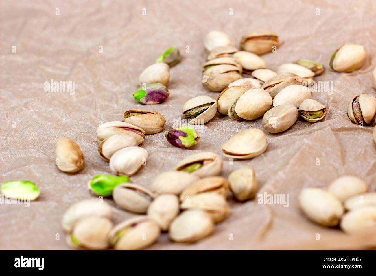Roasted salted pistachio nuts in nutshell on light background Stock Photo - Alamy