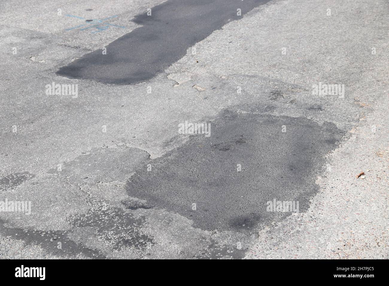 Patched local street in Stockholm city, Sweden. Road maintenance ...