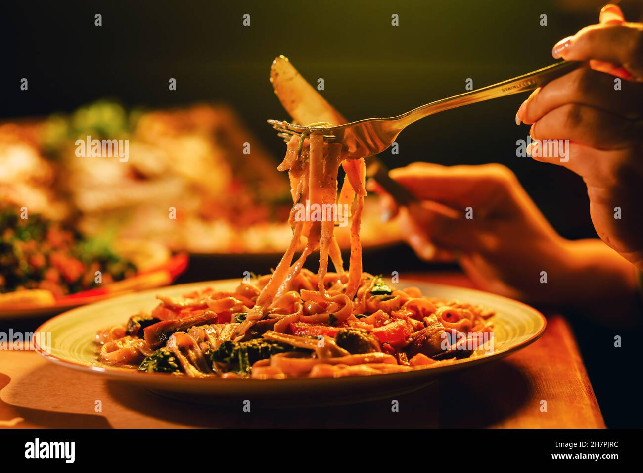 Woman eat traditional noodle in hi-res stock photography and images - Alamy
