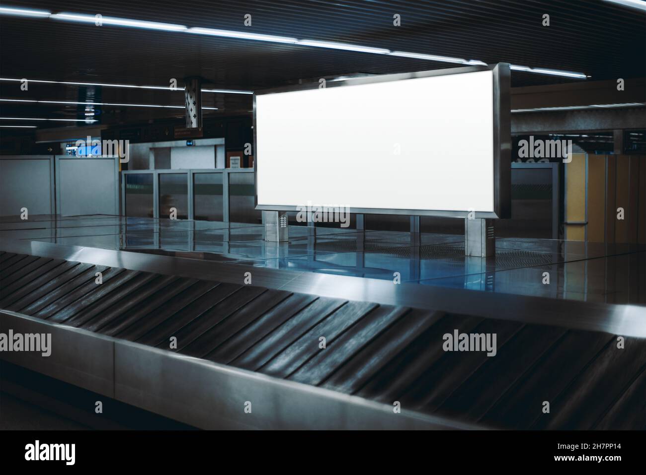 View of a baggage claim area in a hall of a modern airport arrival zone ...