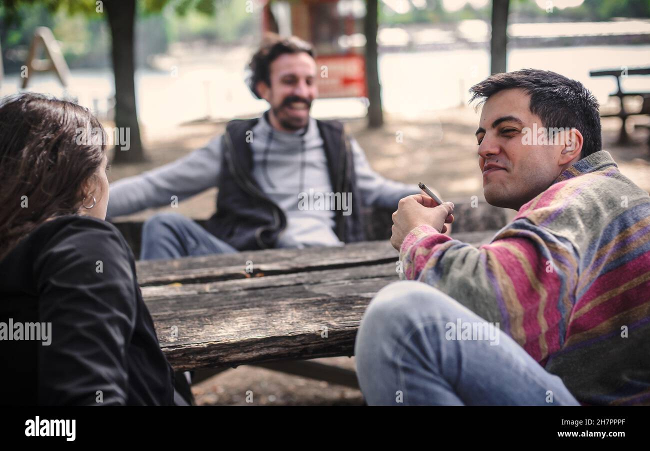 Group of relaxed and smiling happy young friends, female and male ...