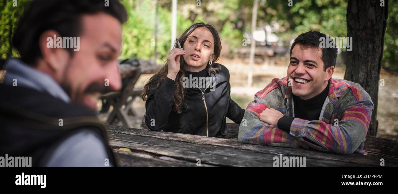 Group of relaxed and smiling happy young friends, female and male ...