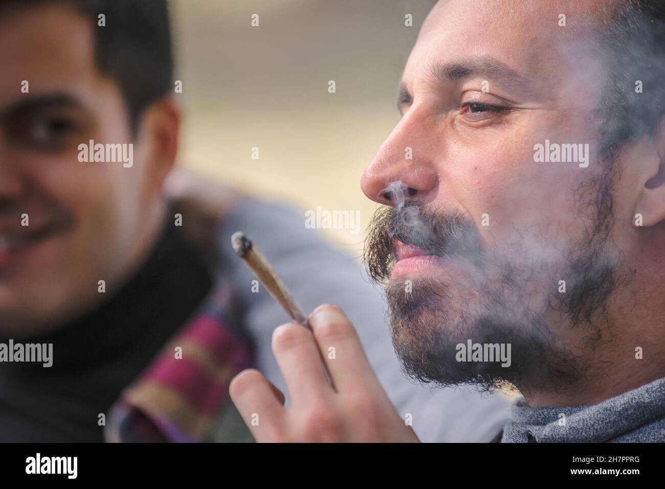 Young couple smoking cannabis in hi-res stock photography and images ...