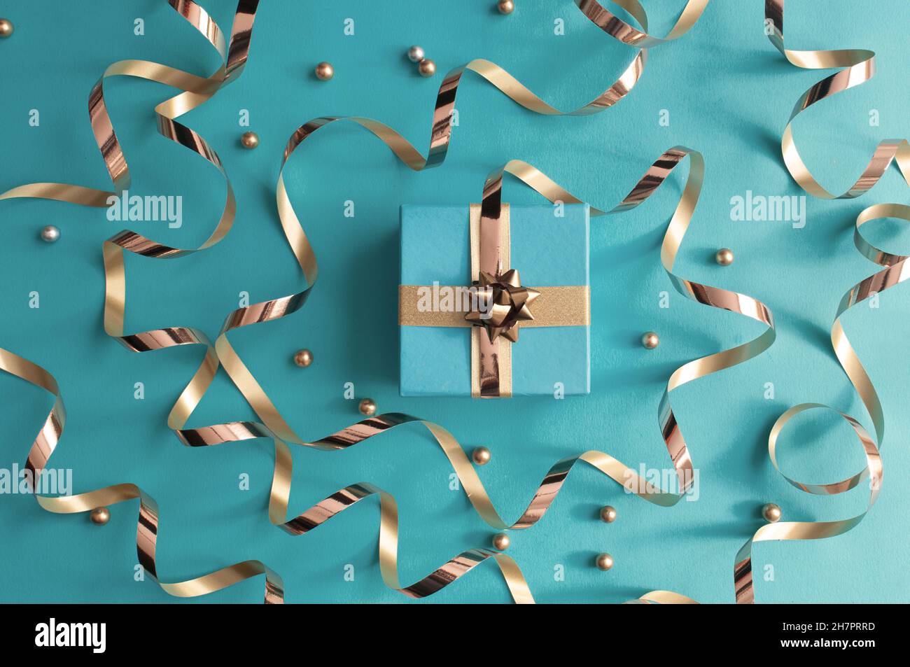 Christmas gift box wrapped with with decorative gold ribbon bow Stock ...