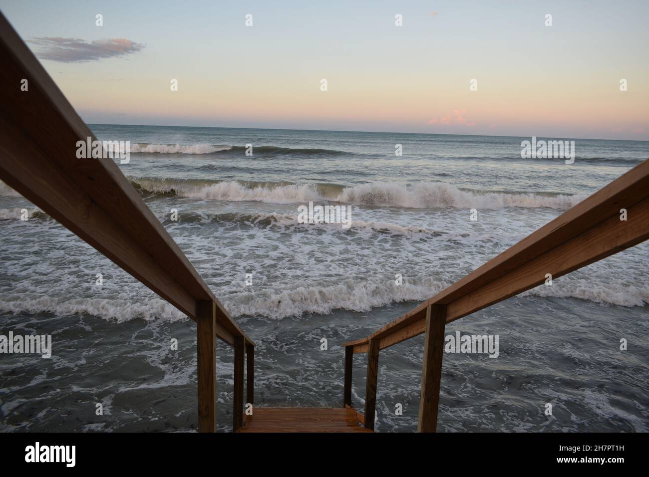Wooden handrails leading to the Atlantic Ocean Stock Photo - Alamy