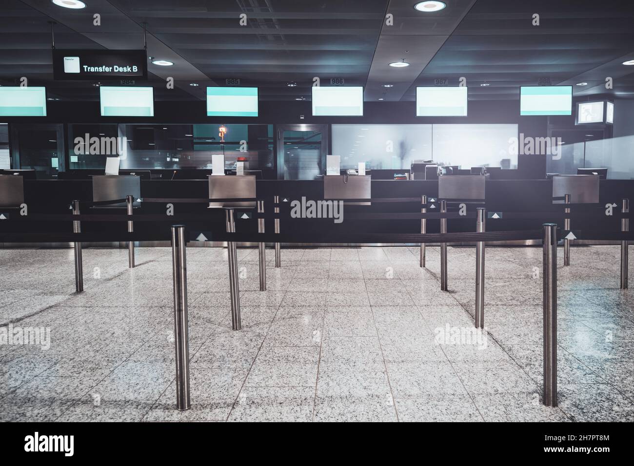 View of an airport check-in area with multiple empty decks for transfer ...