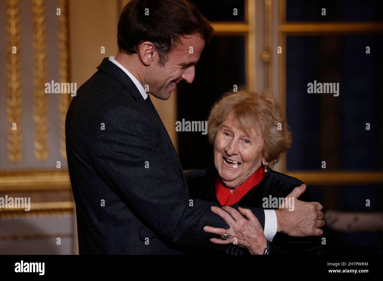 French President Emmanuel Macron (L) awards with the Medal of Honor ...