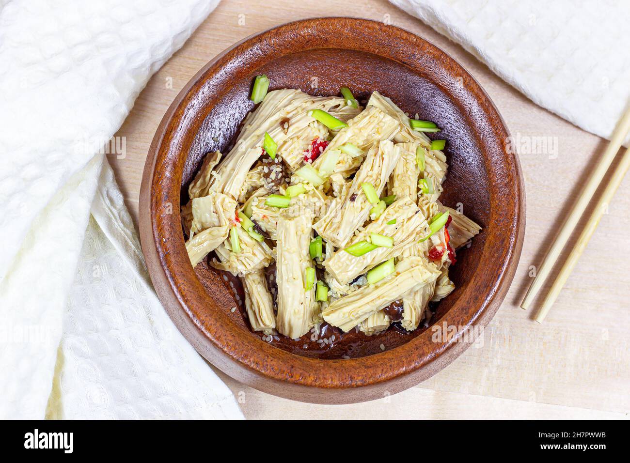 Top view of Asian fuzhu salad (yuba sticks, soy bean curd, tofu skin ...