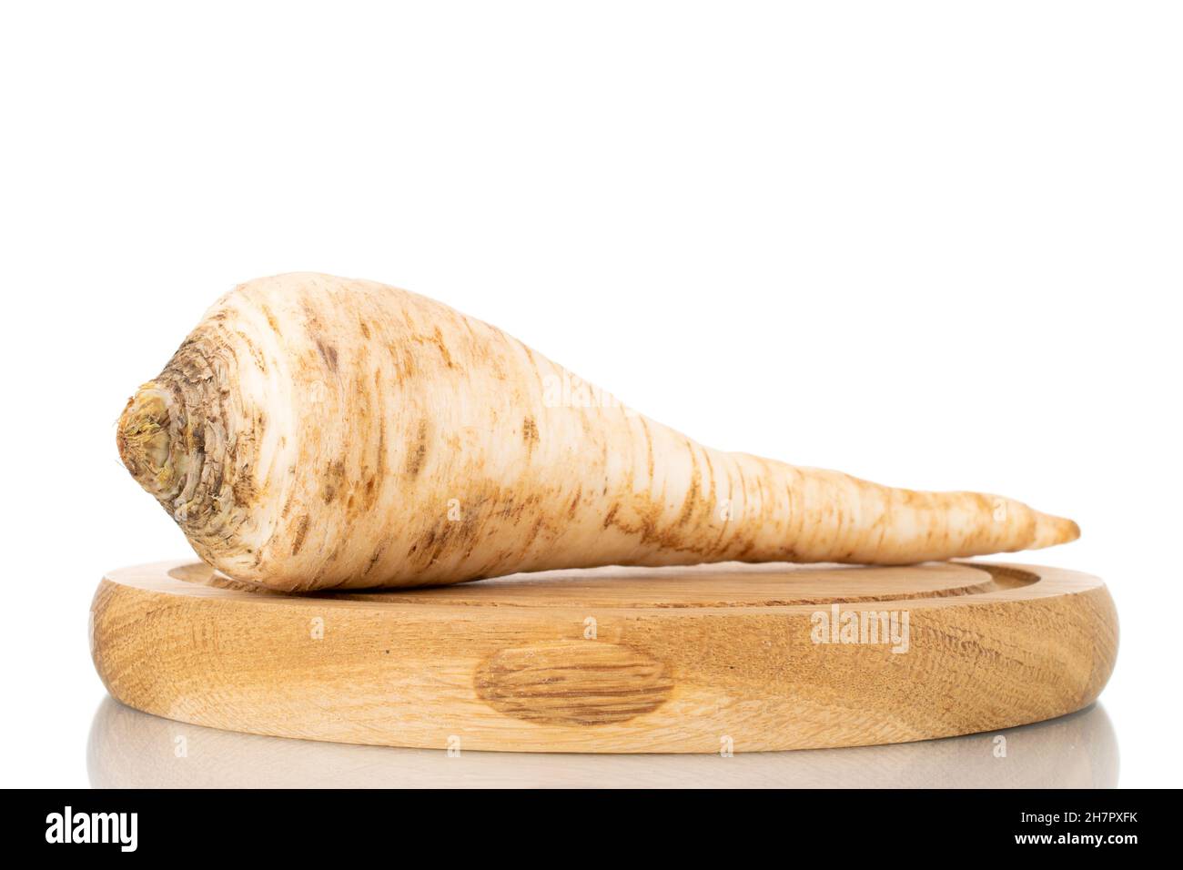 One spicy parsnip on a wooden tray, close-up, isolated on white Stock ...