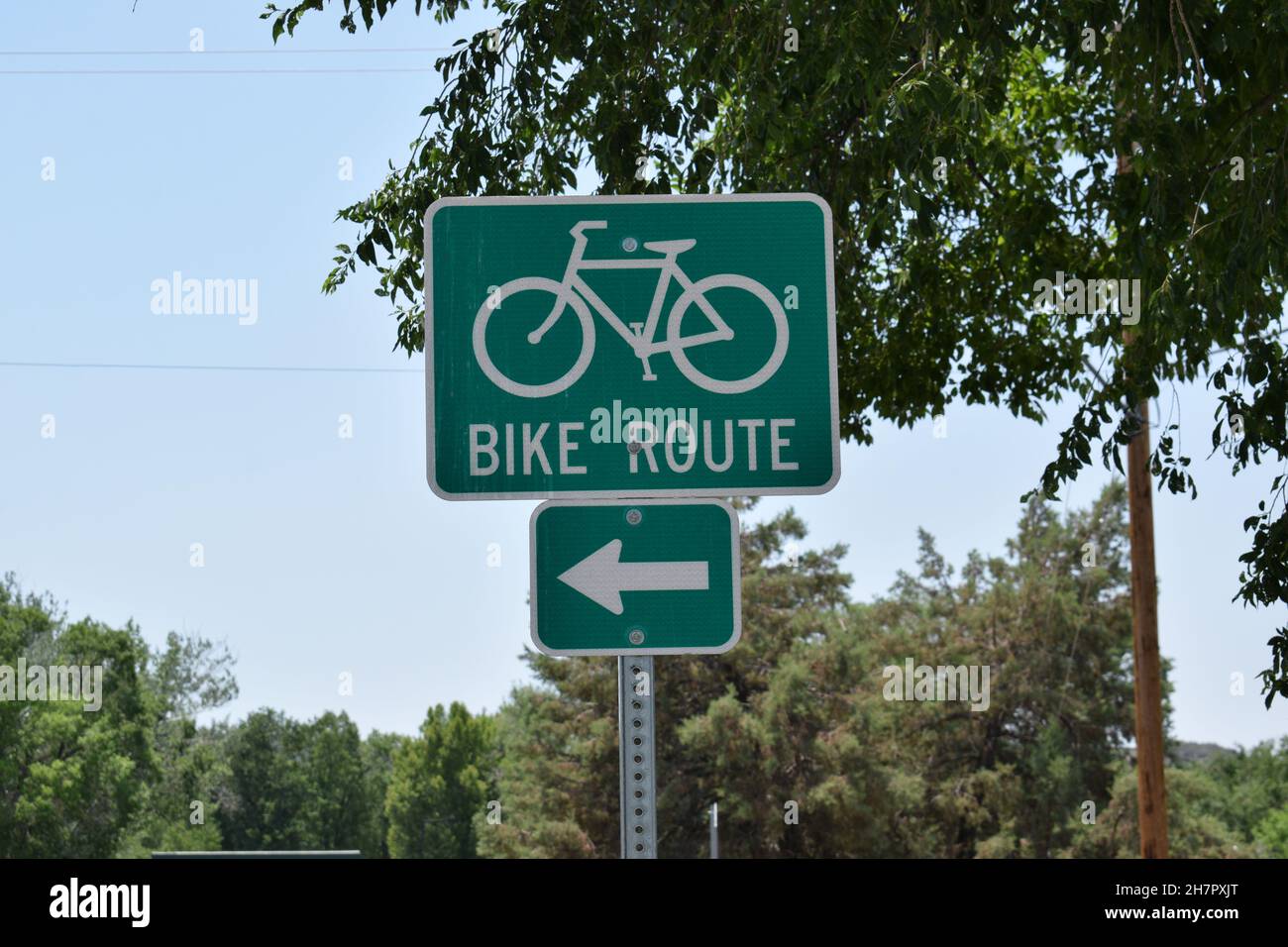 A sign designates the direction of the bicycle route Stock Photo - Alamy