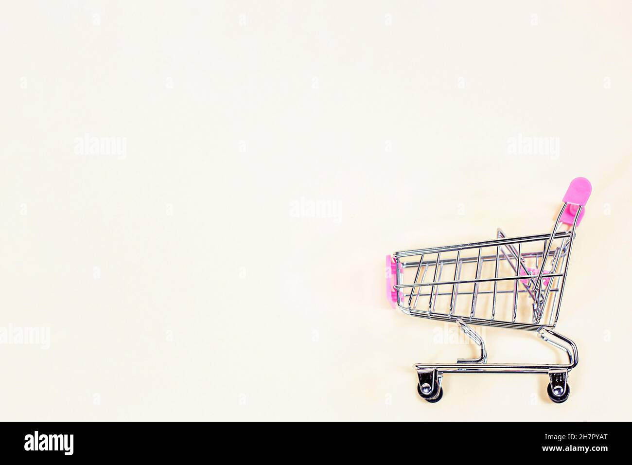 Pink empty shopping cart from the supermarket as a symbol of ...