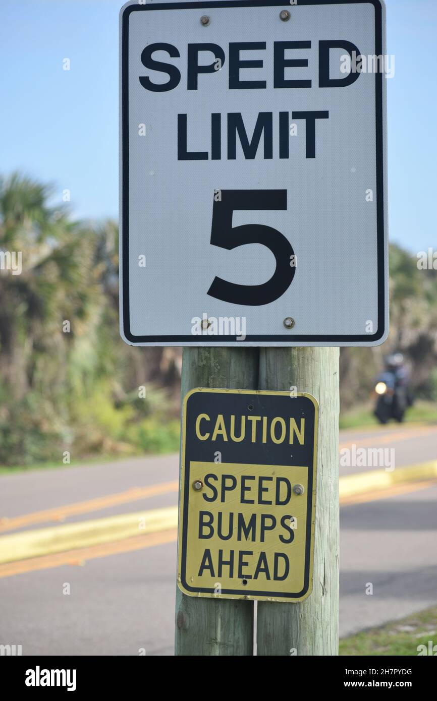 Speed limit signs warn to slow down Stock Photo - Alamy