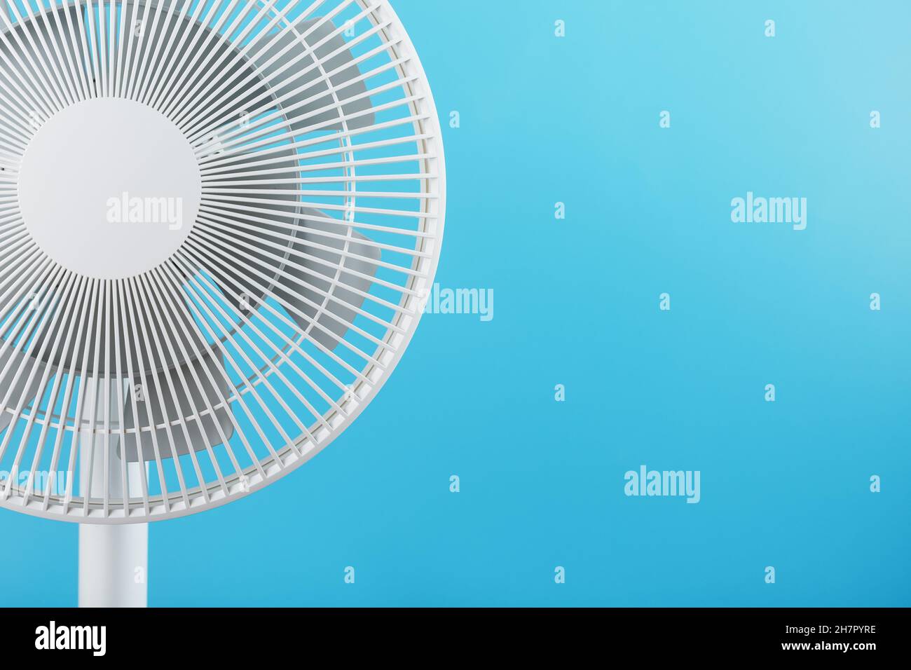 Electric fan in white with a modern design for cooling the room on a ...