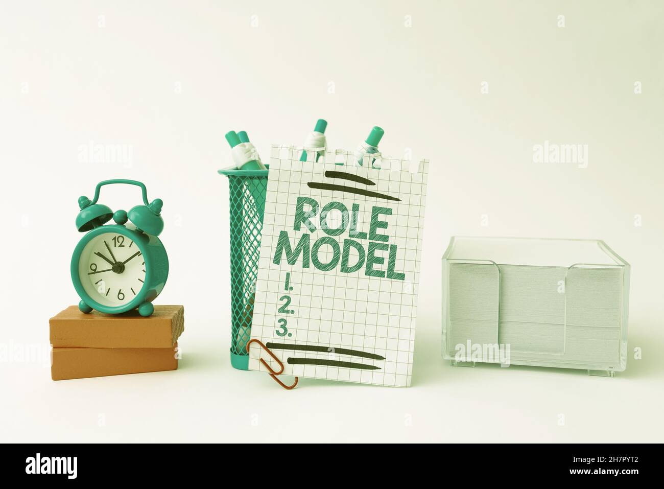 Hand writing sign Role Model. Word Written on a person looked to by ...