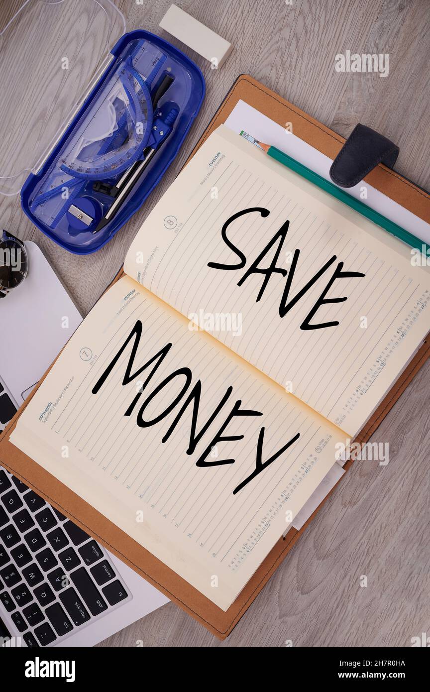Hand writing sign Save Money. Word Written on store some of your cash ...