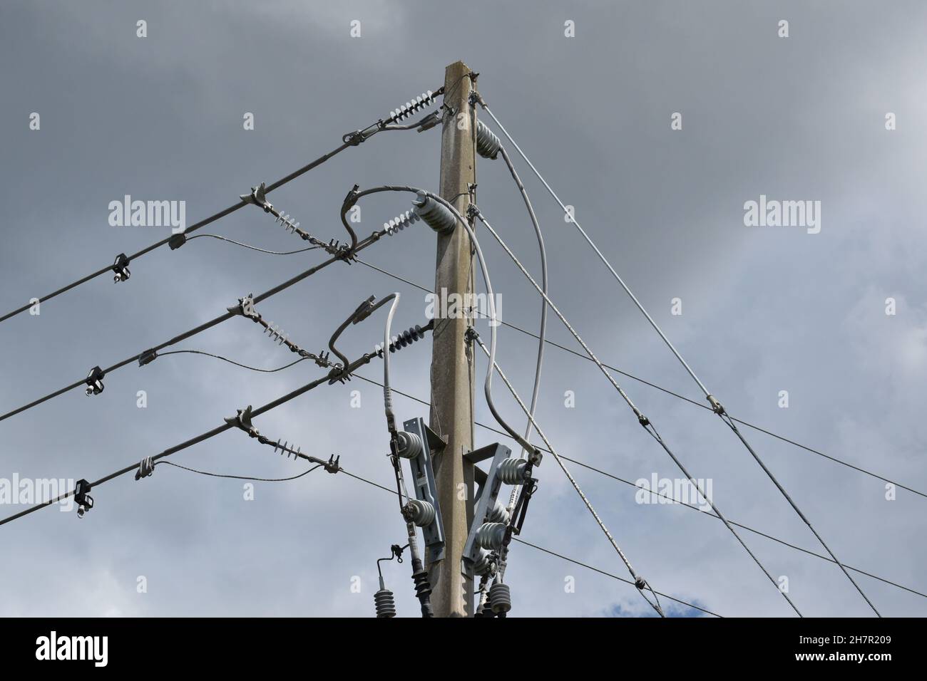 Electrical power lines form a triangle over a modern utility pole Stock ...