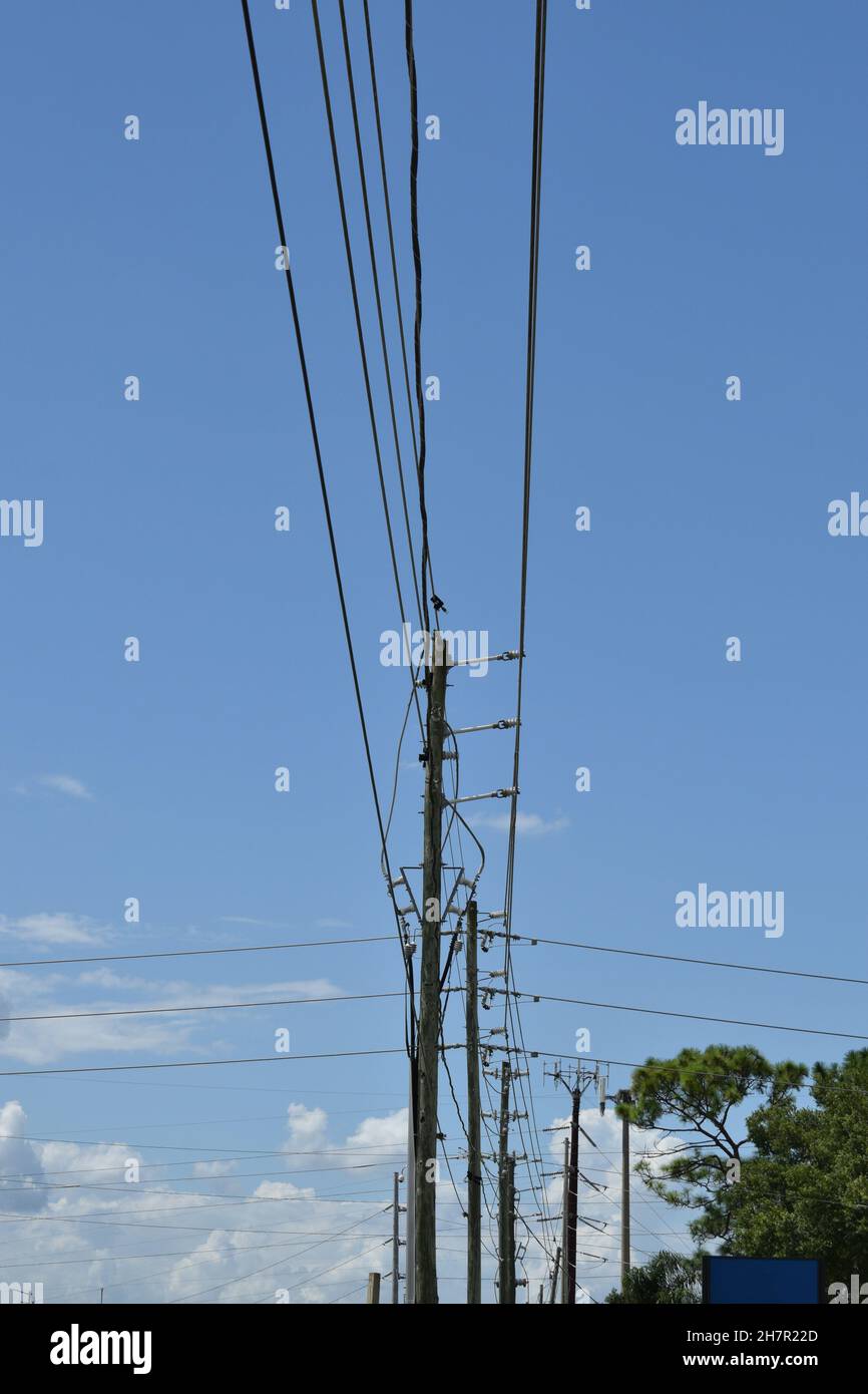 Utility poles and wires in a row Stock Photo - Alamy