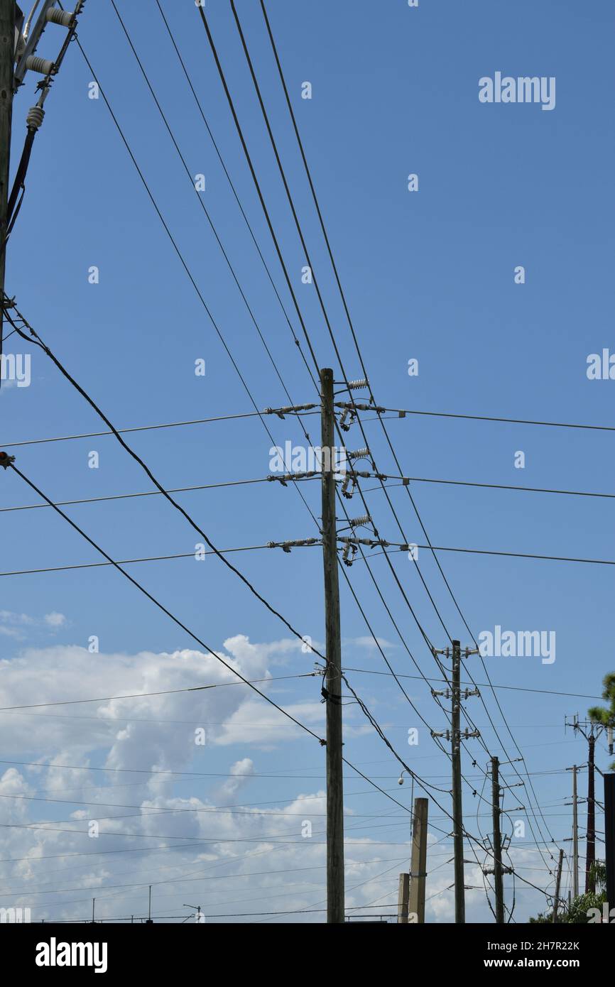 Power lines intersect at varied angles across the horizon Stock Photo ...