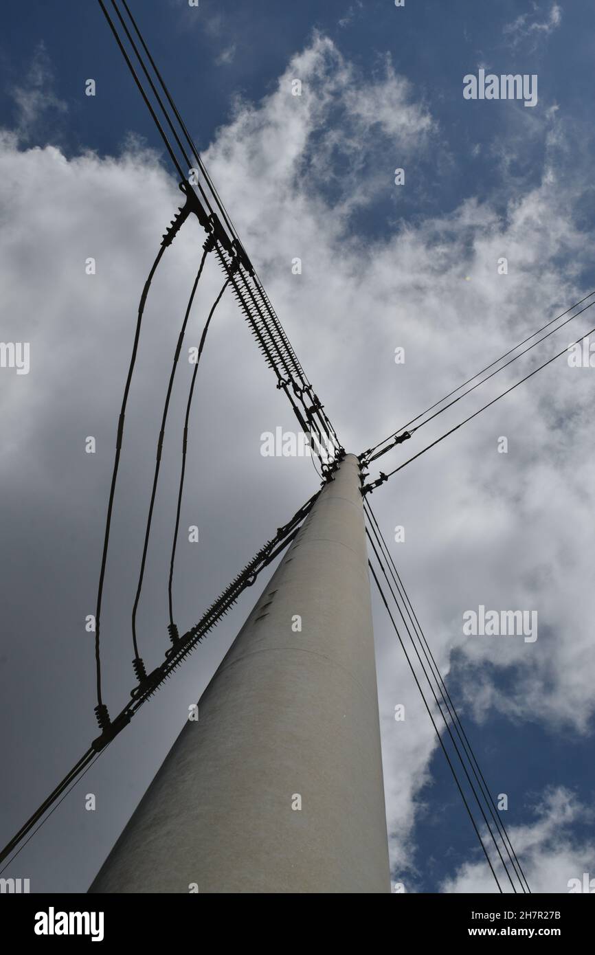 View from below a high voltage power pole Stock Photo - Alamy